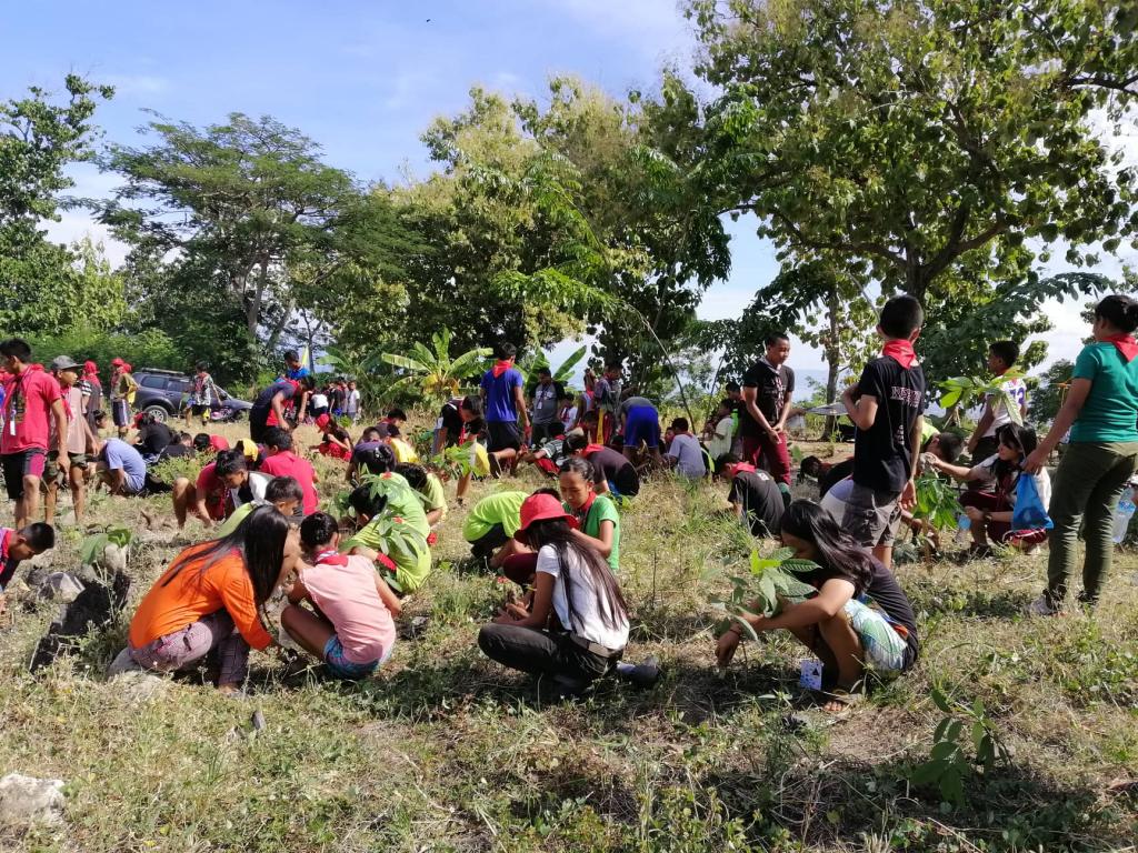 Scouts attending a camp in the Philippines take action for the ...