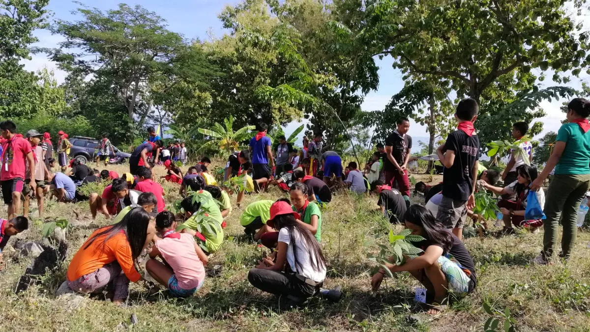 Scouts attending a camp in the Philippines take action for the ...